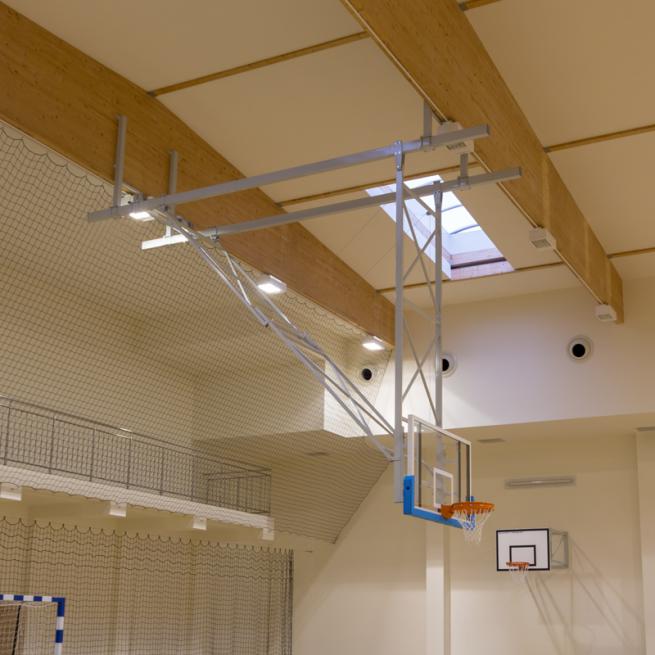 CEILING-MOUNTED BACKSTOP WITH DRIVE MECHANISM