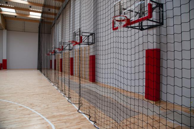 BALL CATCHING NETS BEHIND HANDBALL GOALS